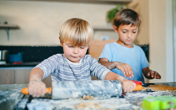 We dont make memories, we bake them. Shot of two adorable little boys ...