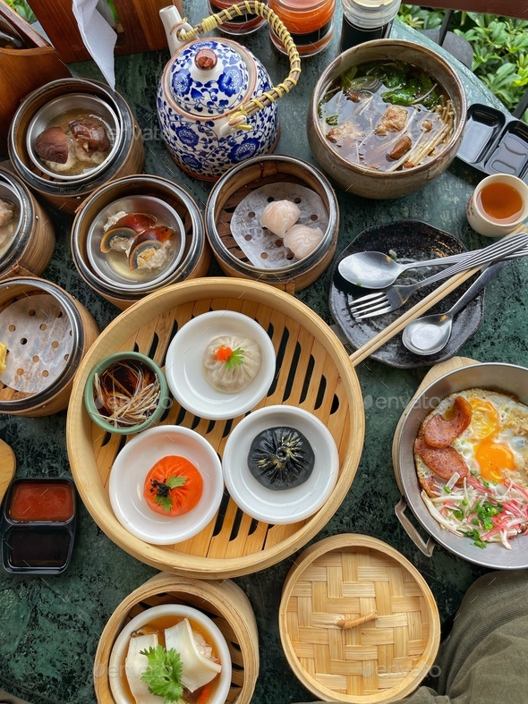 Chinese steamed dim sum in bamboo container with soy sauce. select and ...