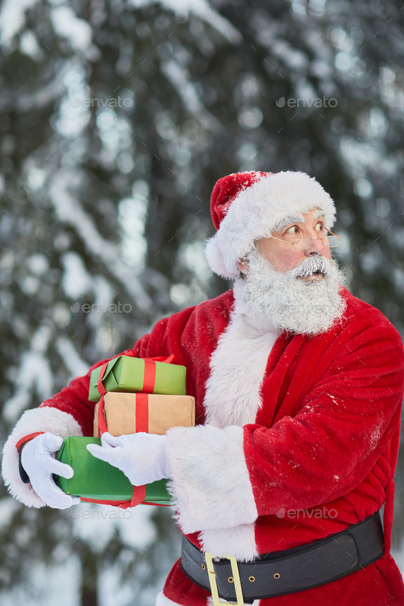 Santa Claus Delivering Presents Stock Photo by seventyfourimages ...
