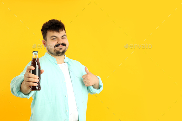 Concept of people, young fat man on yellow background Stock Photo by ...