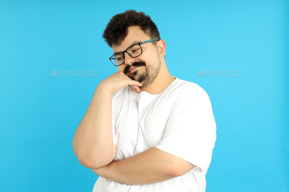 Concept of people, young fat man on blue background Stock Photo by ...