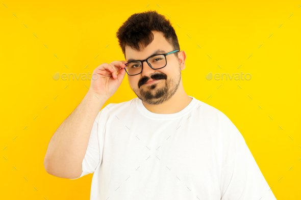Concept of people, young fat man on yellow background Stock Photo by ...