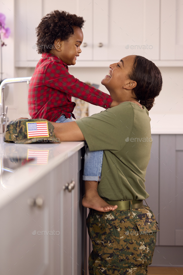 American Army Mother In Uniform Home On Leave Hugging Son In Family ...