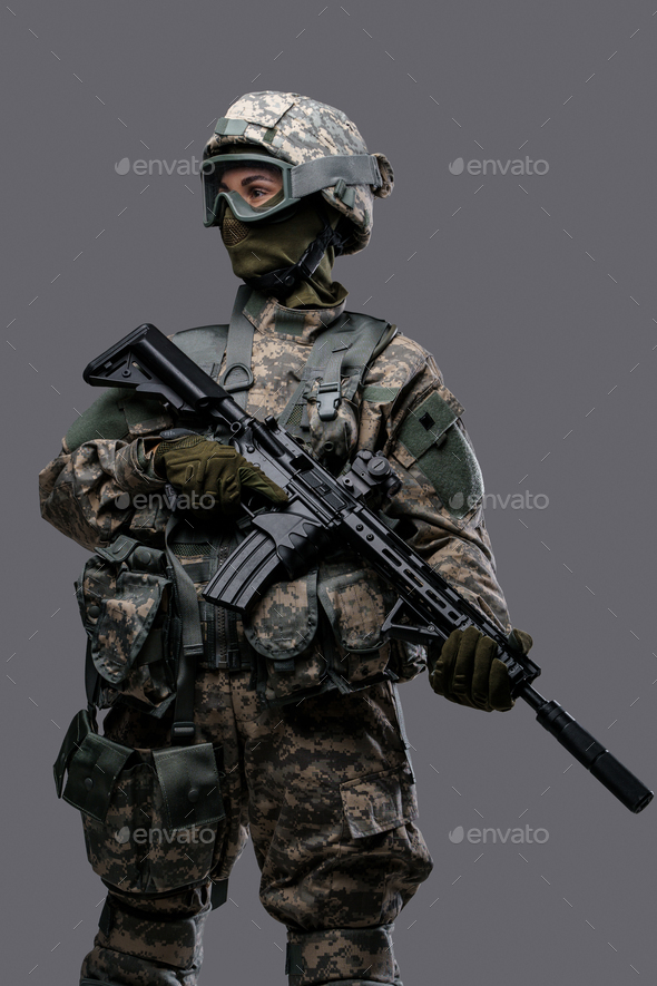 Soldier woman with rifle dressed in modern protective uniform Stock ...