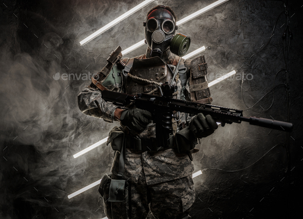 Apocalyptic army soldier with gas mask holding rifle Stock Photo by ...