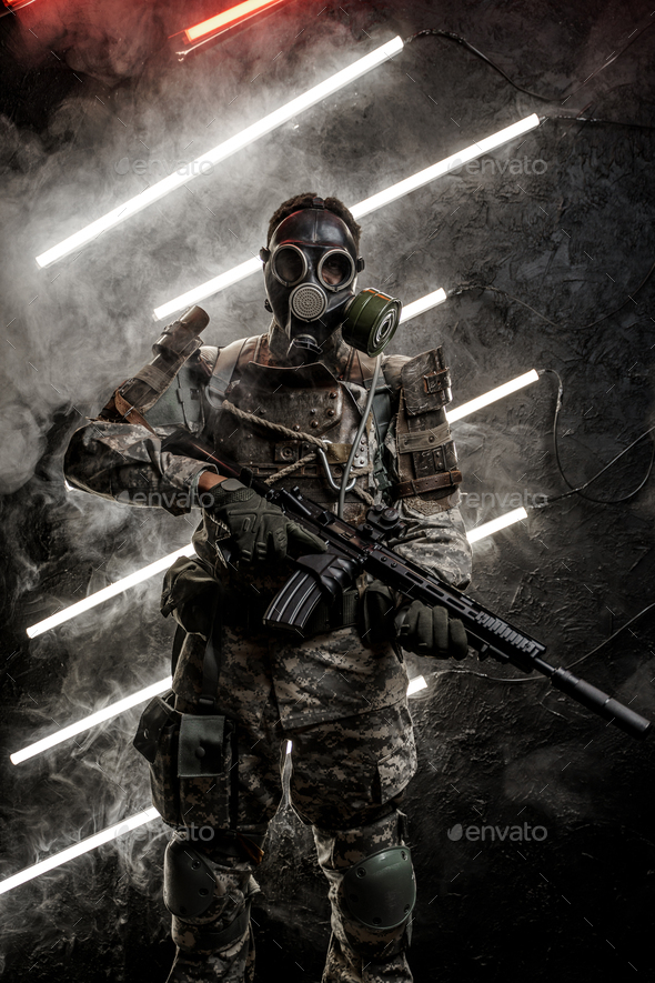 Apocalyptic army soldier with gas mask holding rifle Stock Photo by ...