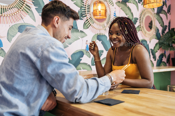 Multicultural Friends Enjoying Poke Bowl Stock Photo by nunezimage