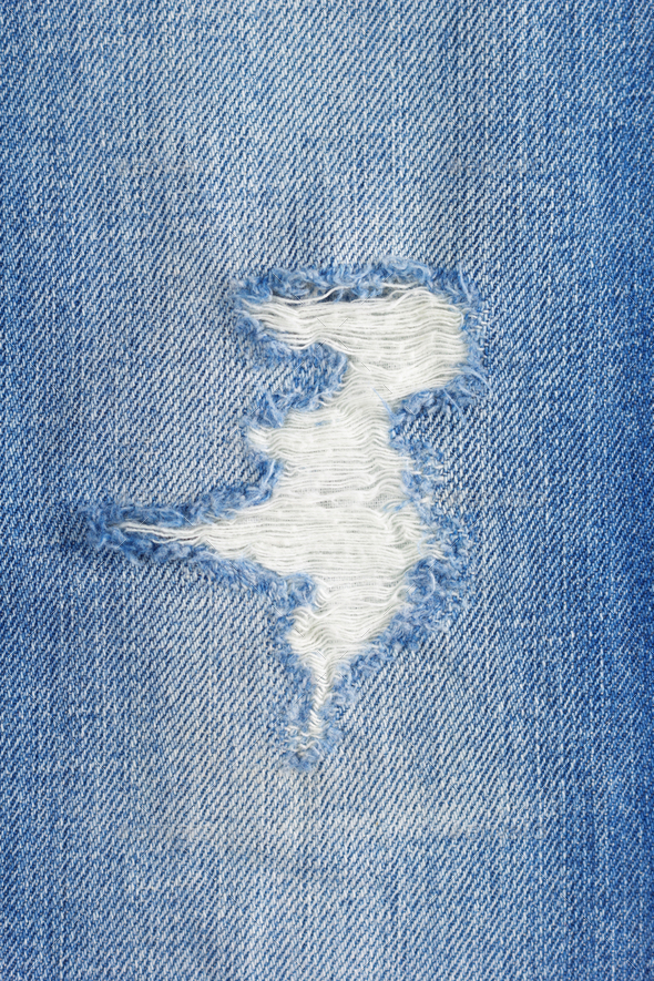 Torn jeans denim background texture. Blue jeans fabric as material ...