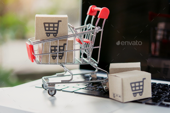 Shopping online. Cardboard box with a shopping cart logo in a trolley ...