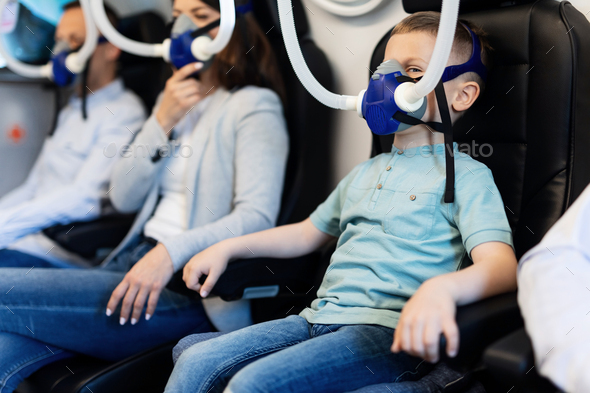 Small boy with his parents during hyperbaric oxygen therapy at clinic ...