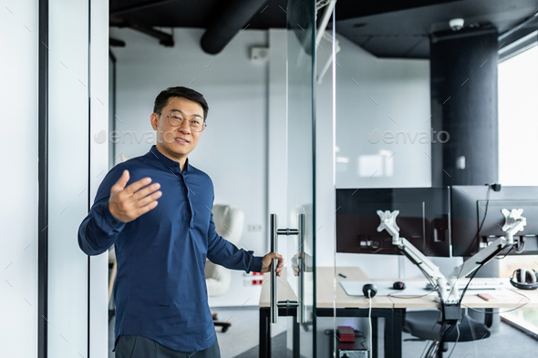 A successful engineer programmer boss invites to his office, an Asian ...