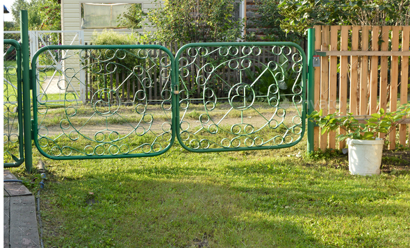 Green metal gate with a wicket - fence garden Stock Photo by ClaireLuci