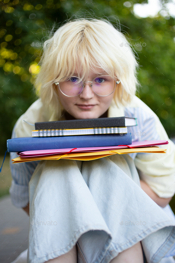Vertical blurred photography of student girl with her books. Stock ...