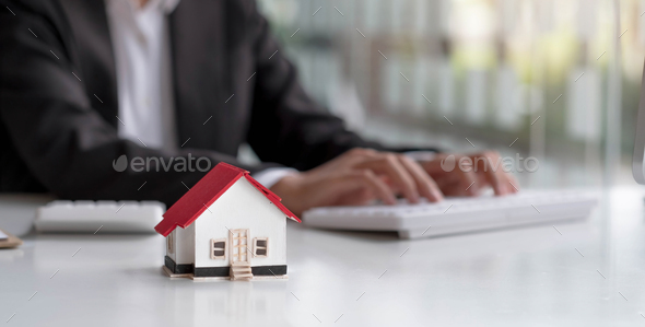 Close up real estate business woman working with pc computer for ...