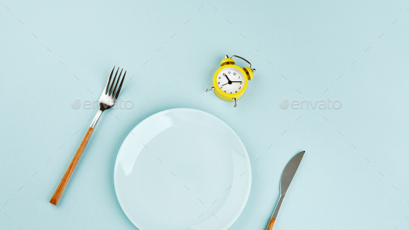 Intermittent fasting, diet, lunch time concept. Stock Photo by TaniaJoy