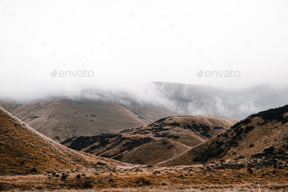 sad mountains in a desolate landscape without trees and with some ...