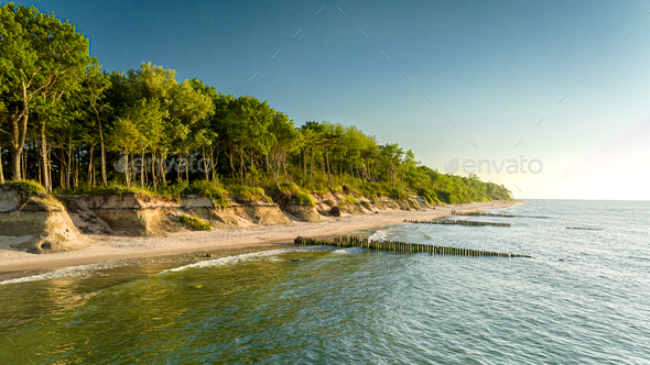 Baltic Sea and empty beach in summer at sunset. Stock Photo by Shaiith