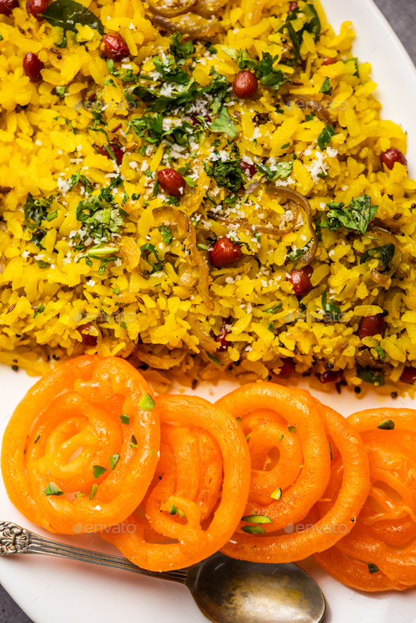Aloo Poha with Jalebi, snack combination also called imarti and kande ...