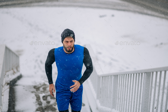 Man running on a stairs on a cold winter day. Stock Photo by ...