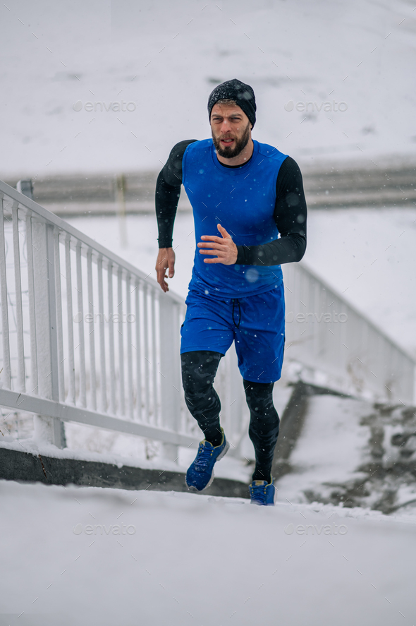 Man running on a stairs on a cold winter day. Stock Photo by ...