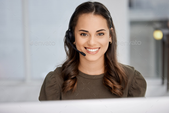 Cropped portrait of an attractive young female call center agent ...