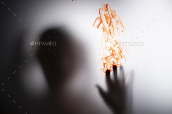 Shadowy figure, child behind glass with blood - horror background Stock ...