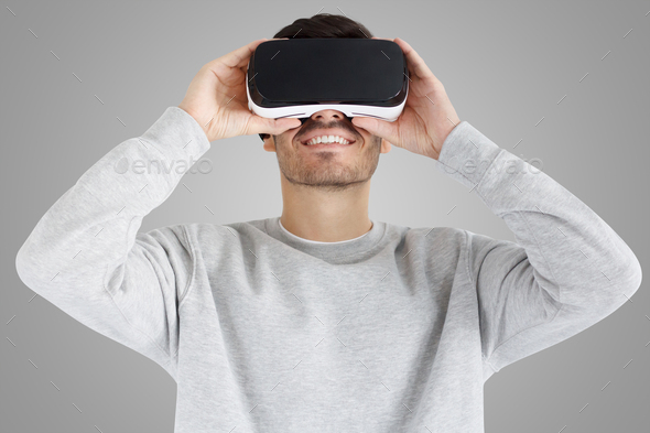 Man playing video games in VR goggles or 3d glasses, wearing virtual ...