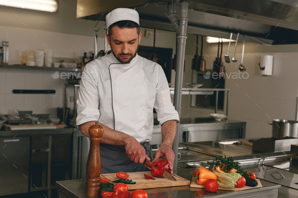 Chef preparing salad in the modern kitchen of restaurant. Tasty and ...