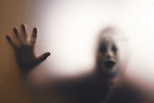 Shadowy figure behind glass - horror background Stock Photo by erika8213