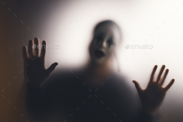 Shadowy figure behind glass - horror background Stock Photo by erika8213