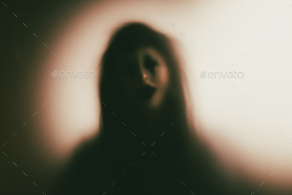 Shadowy figure behind glass - horror background Stock Photo by erika8213