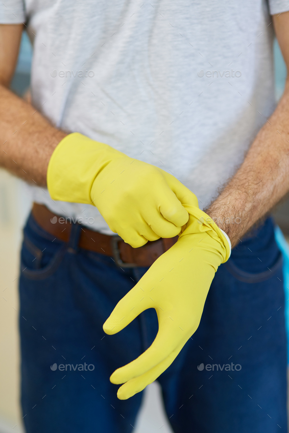 Get started. Close up shot of hands of man, professional male cleaner ...