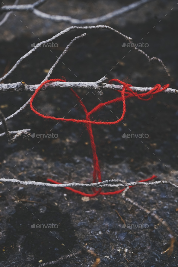Red thread tangled in a dry branch Stock Photo by nanihta | PhotoDune