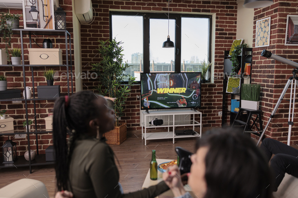 Group of people celebrating video games win on television console Stock ...