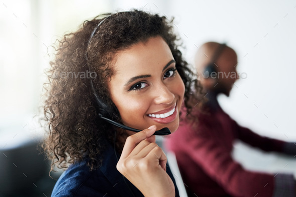 Cropped portrait of an attractive young female call center agent ...