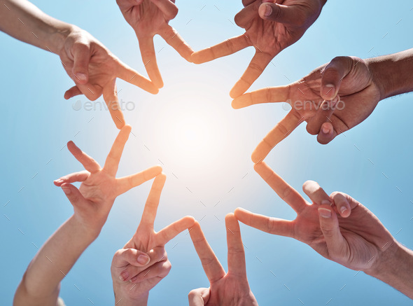 Shot of a group of unrecognizable people making a star shape with their ...