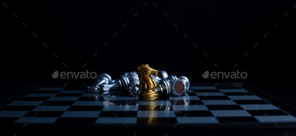 Chess board game between silver team and golden team golden team is ...