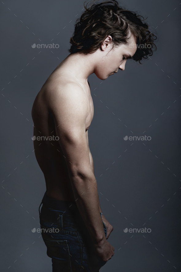 The profile of masculinity. Studio shot of a handsome young man posing ...