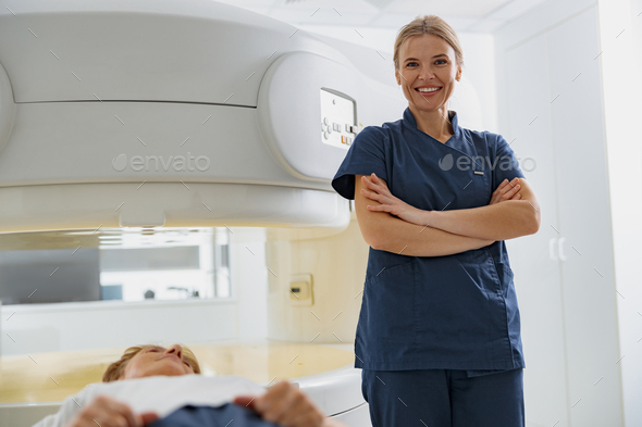 Portrait of doctor radiologist on background of MRI or CT Scan with ...