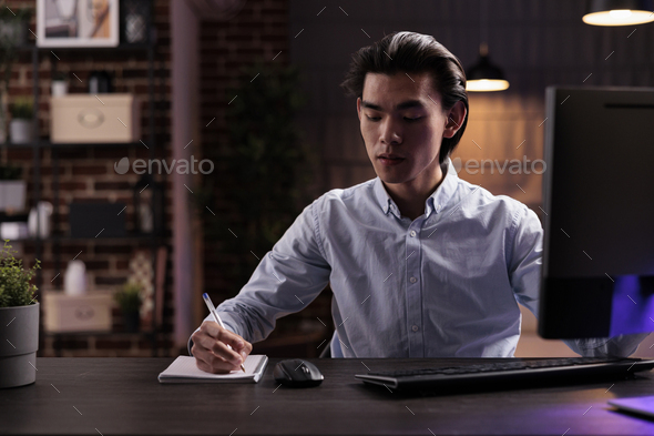 Office worker taking notes on files Stock Photo by DC_Studio | PhotoDune