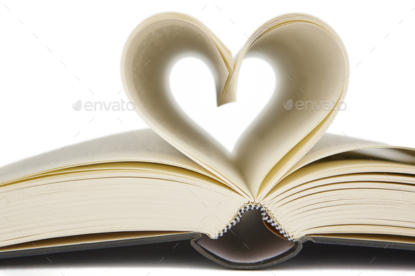 Open book with heart shaped pages. Love for reading Stock Photo by ABBPhoto