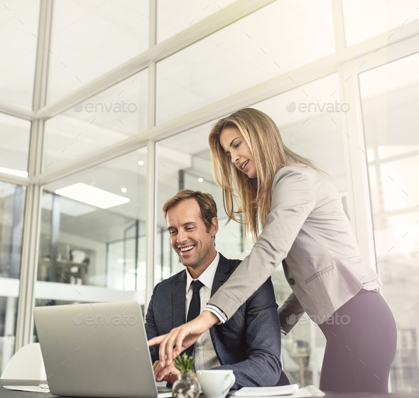 Building upon their successes. Shot of a two executives working ...