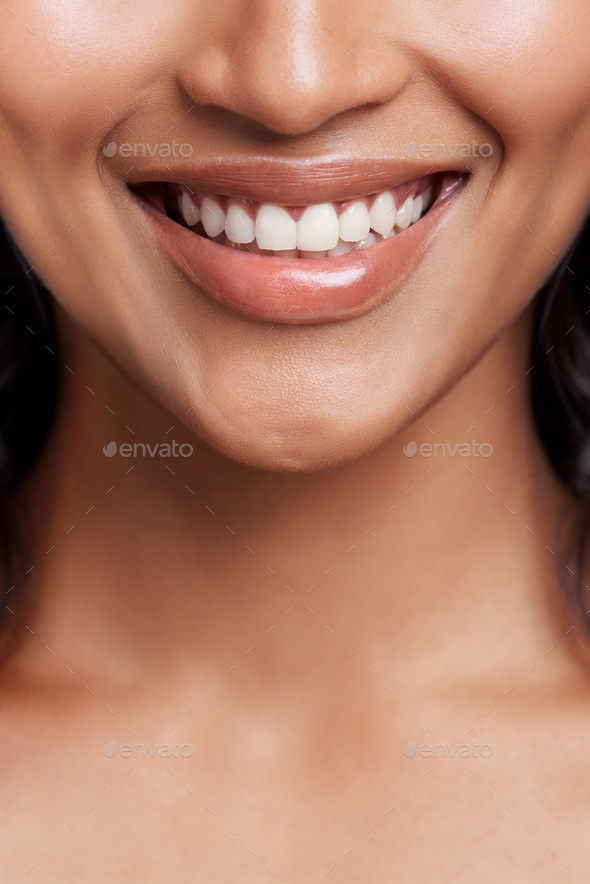 The best curve on your body is your smile. Cropped shot of a womans ...