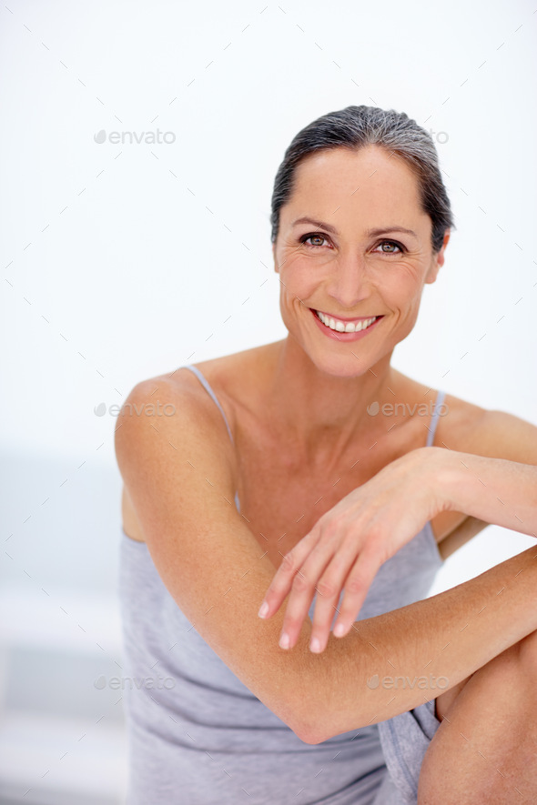 Keeping her body in great shape. Portrait of a beautiful mature woman ...