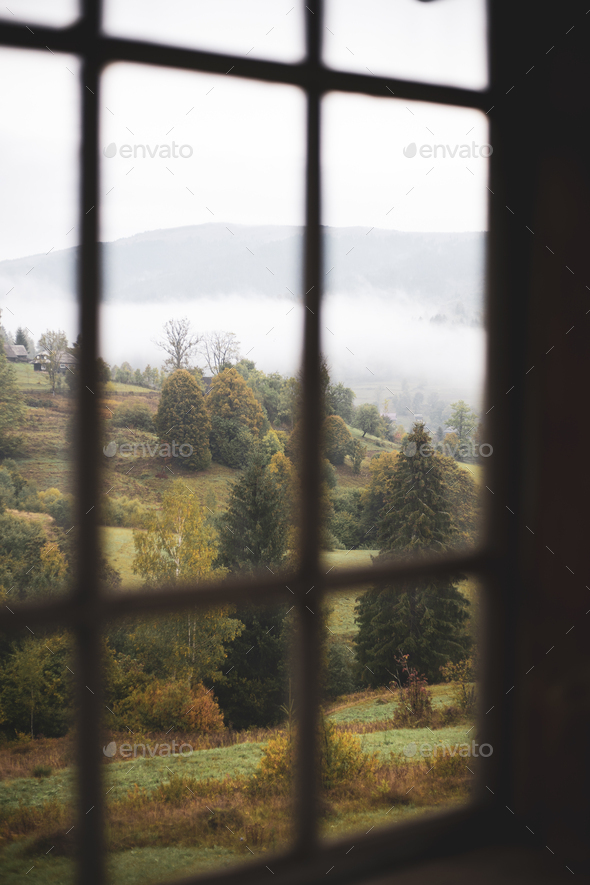 view through the window on a mountain landscape Stock Photo by azgek