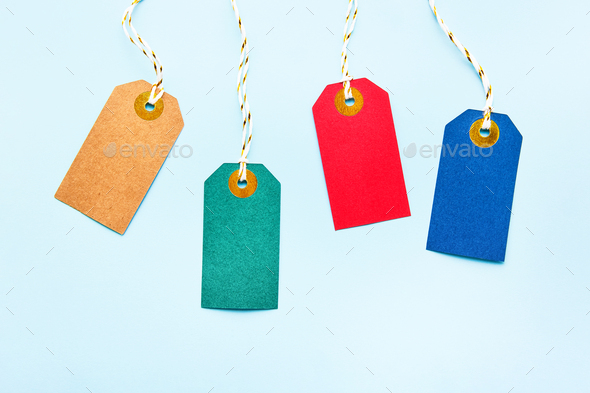 Colorful blank sale tags on a blue background. Black Friday and sales ...