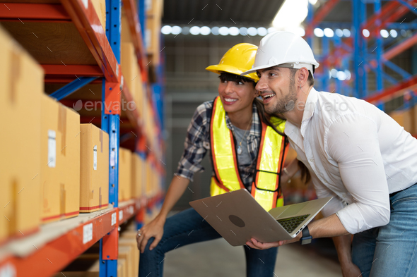 Supervisor and manager smiling happy holding laptop computer Stock ...