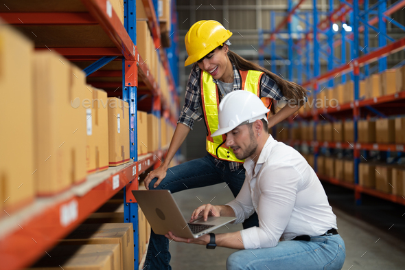 Supervisor and manager smiling happy holding laptop computer Stock ...