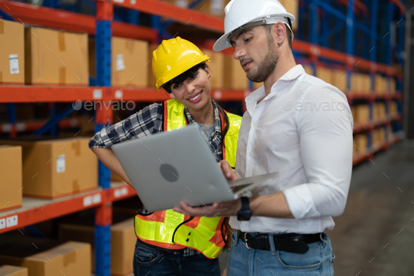 Supervisor and manager smiling happy holding laptop computer Stock ...