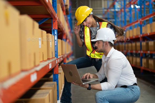 Supervisor and manager smiling happy holding laptop computer Stock ...